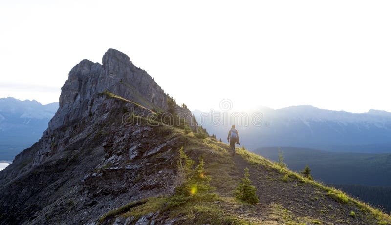 Male Hiker Walks Along Ridge of Mountain during Sunrise Stock Photo ...