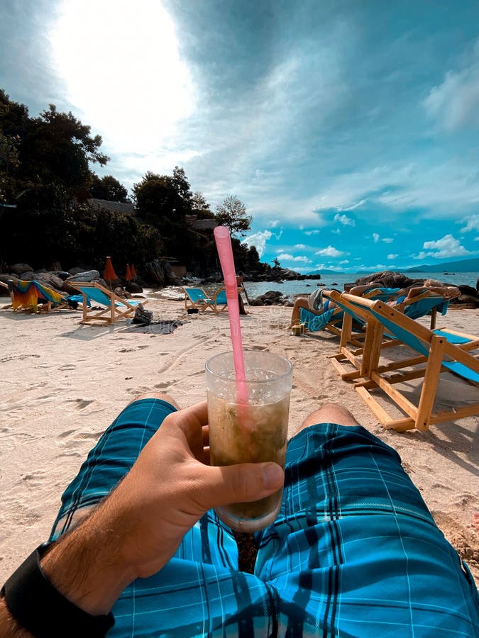 Male Holding Ice Coffee in the Beach on a Sunny Day Stock Image - Image ...