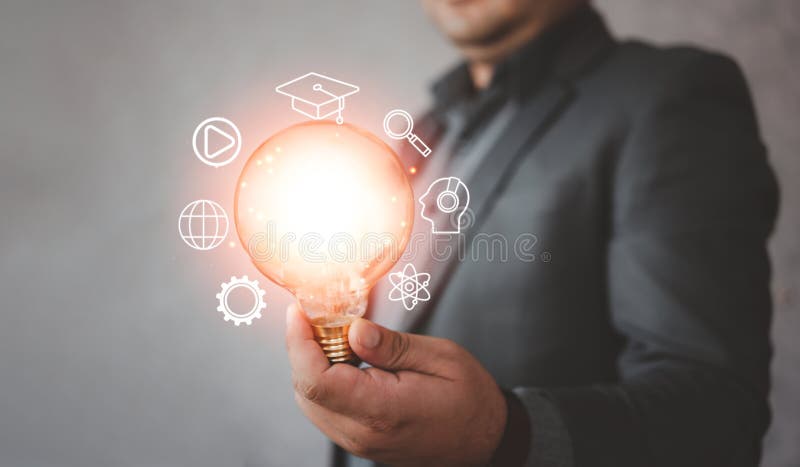 Male Holding a Lightbulb with Icons of Learning, Study Knowledge To ...