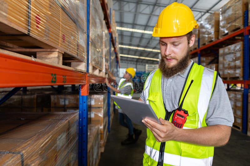 Male Holding Tablet Quality Control Standing of Factory Warehouse ...