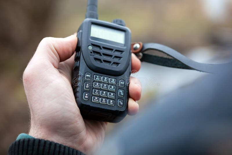 Male holding walkie talkie stock image. Image of hike - 181803107