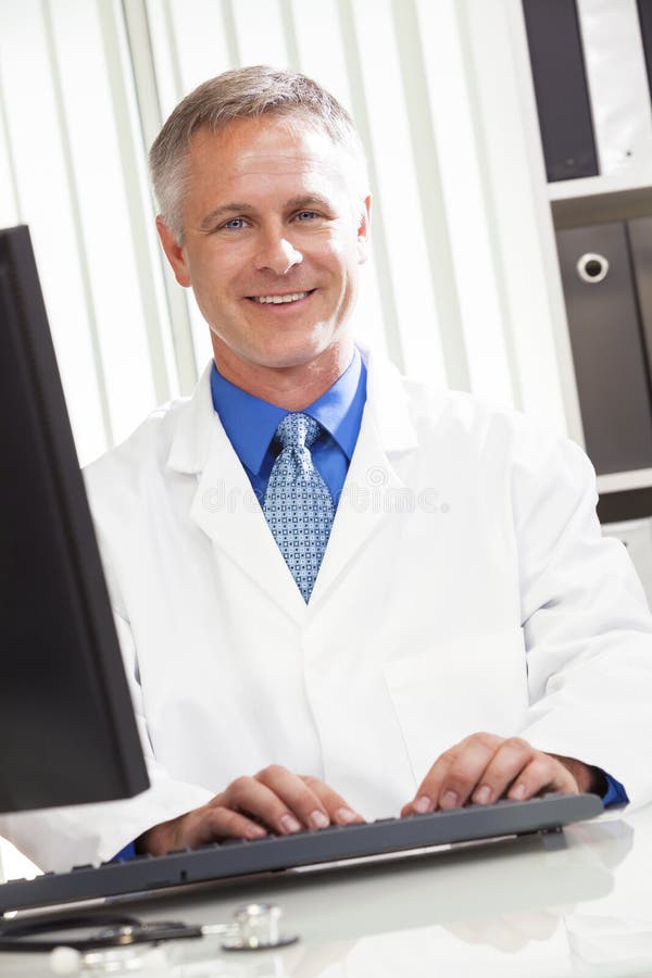 Male Hospital Doctor Using Computer Stock Image - Image of physician ...