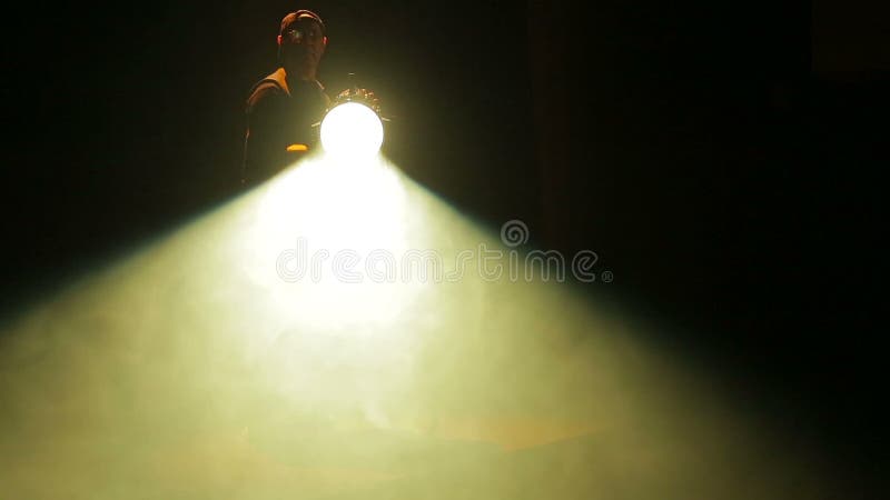 A Male Illuminator Directs a Beam of Light from a Profile Spotlight ...