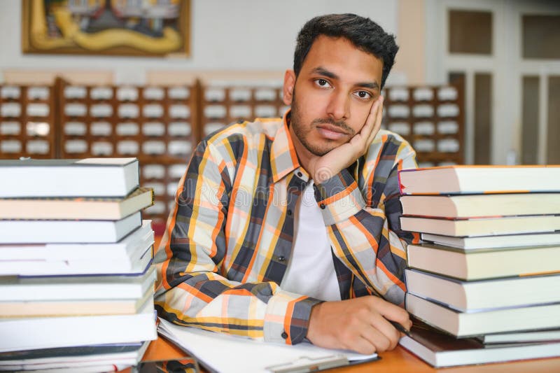 Male Indian Student at the Library with Book Stock Photo - Image of ...