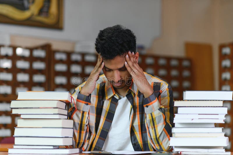 Male Indian Student at the Library with Book Stock Photo - Image of ...