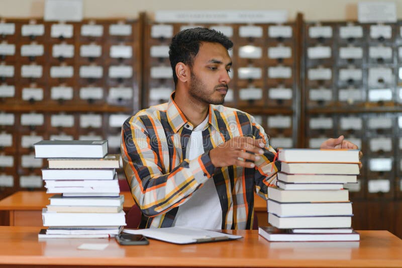 Male Indian Student at the Library with Book Stock Image - Image of ...