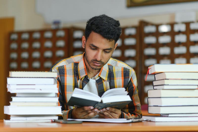 Male Indian Student at the Library with Book Stock Image - Image of ...