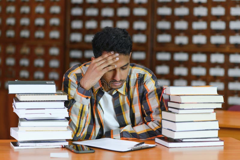 Male Indian Student at the Library with Book Stock Photo - Image of ...