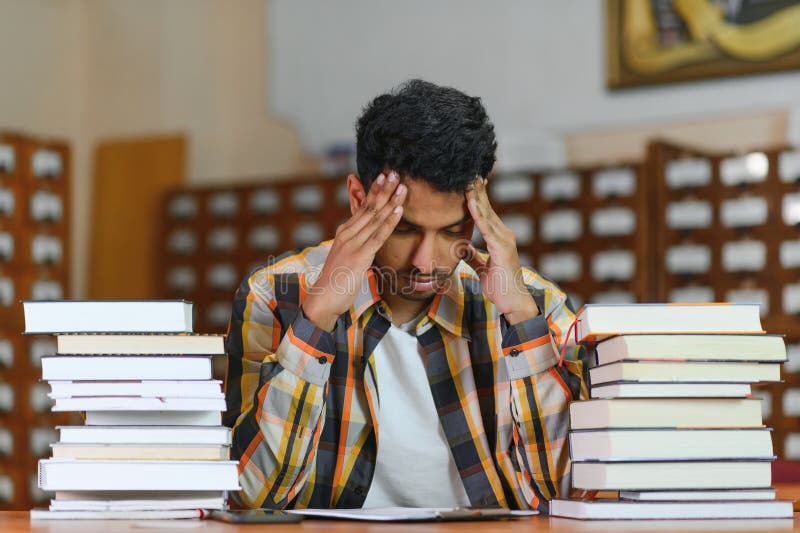 Male Indian Student at the Library with Book Stock Photo - Image of ...