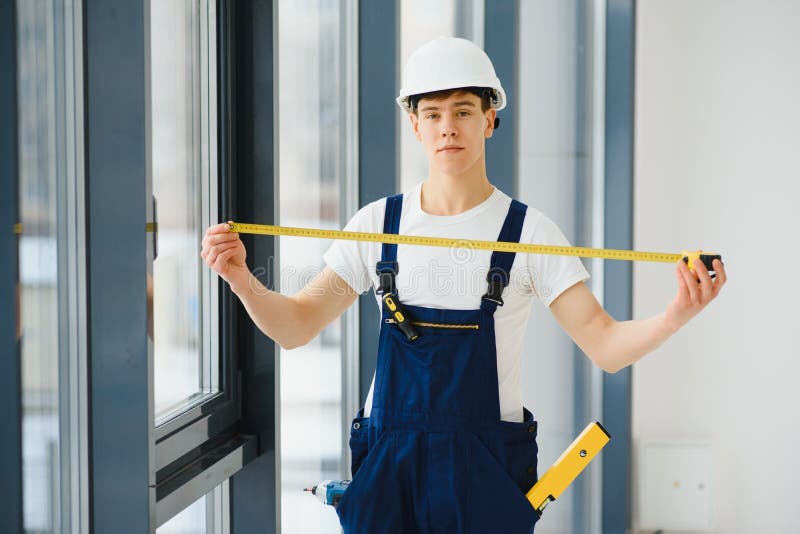 Male Industrial Builder Worker at Window Installation in Building ...