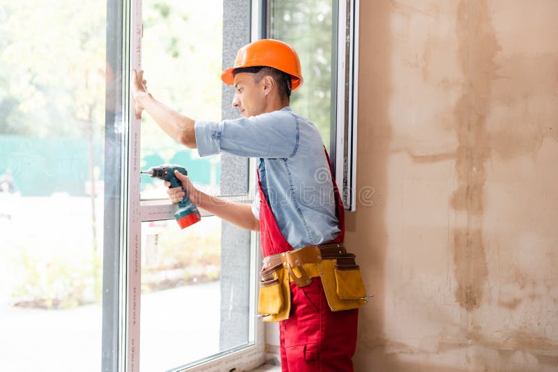 Male Industrial Builder Worker at Window Installation in Building ...