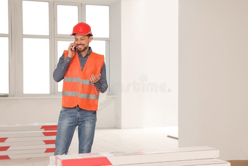 Male Industrial Engineer in Uniform Talking on Phone Indoors Stock ...
