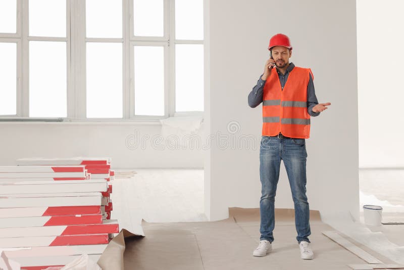 Male Industrial Engineer in Uniform Talking on Phone Indoors Stock ...