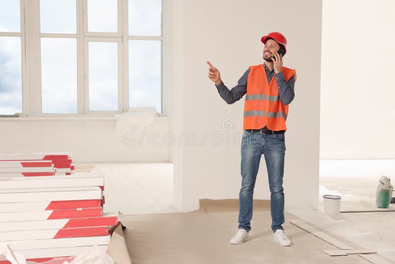 Male Industrial Engineer in Uniform Talking on Phone Indoors Stock ...