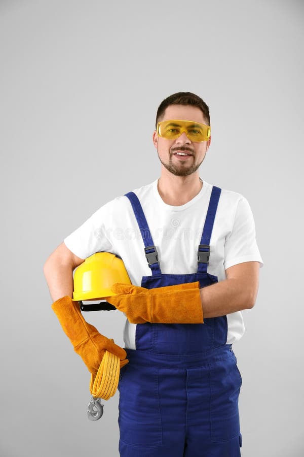 Male Industrial Worker in Uniform on Light Background. Stock Image ...