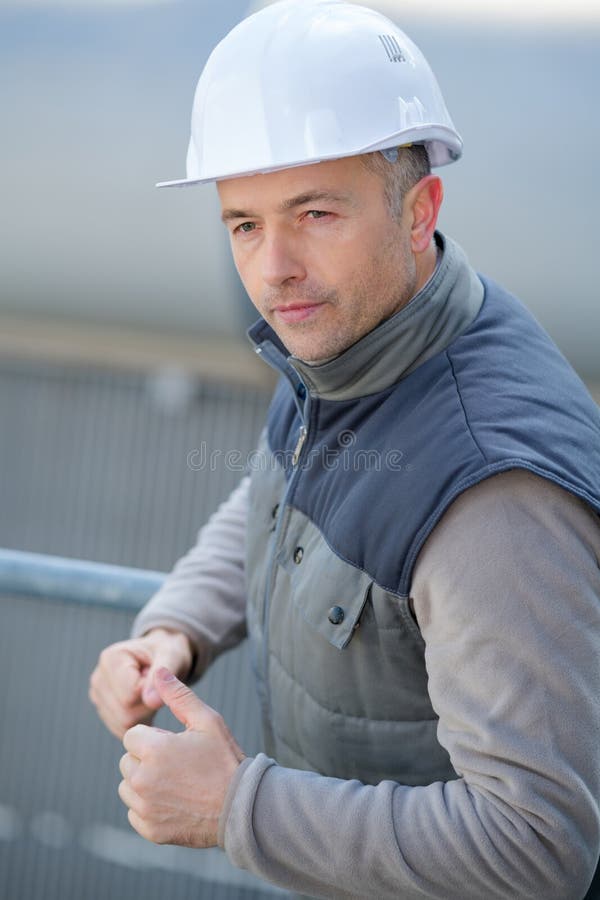 Male Industrial Worker Wearing Hardhat Stock Image - Image of outdoor ...