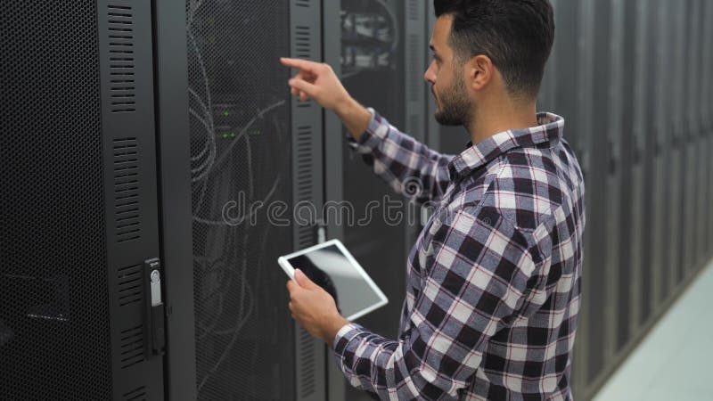 Male Informatic Engineer Working in Server Room Database Stock Footage ...