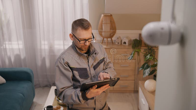 Installer Sets Up Security Camera Using Tablet Stock Photo - Image of ...