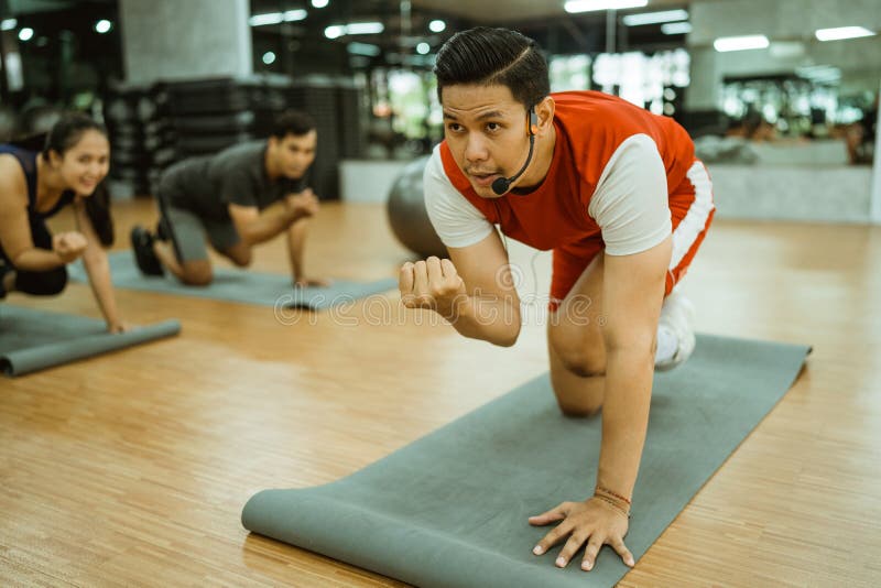 Male Instructor Giving Examples of Movements To Train the Abdominal ...