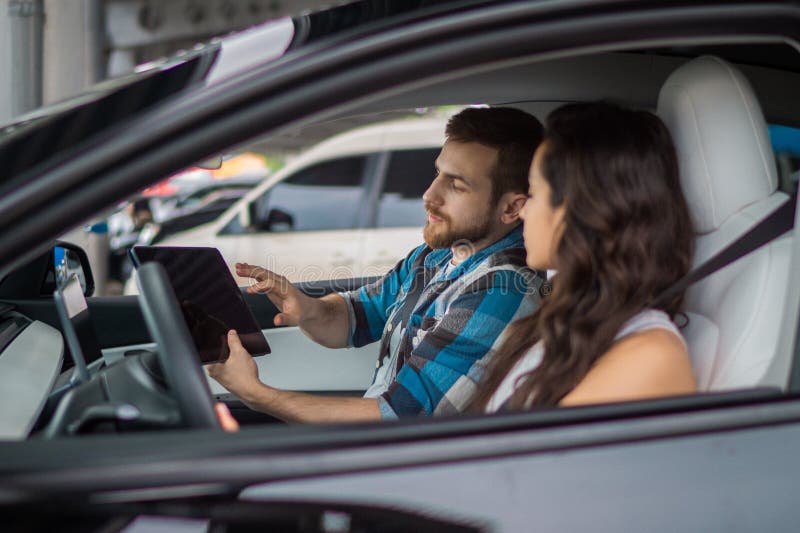 Male Instructor Holding Digital Tablet and Explaining for Woman during ...