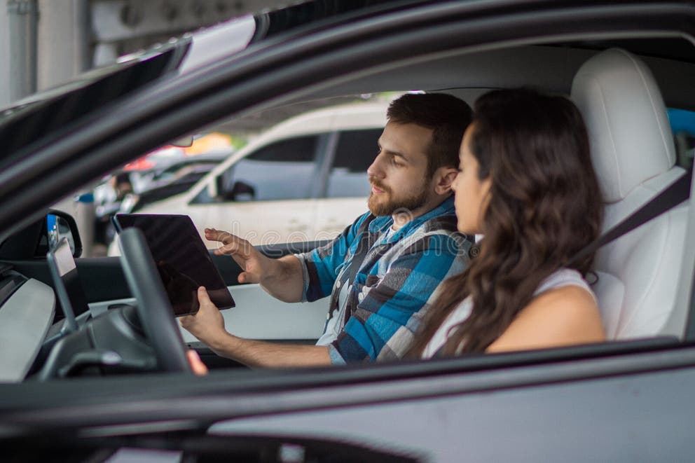 Male Instructor Holding Digital Tablet and Explaining for Woman during ...