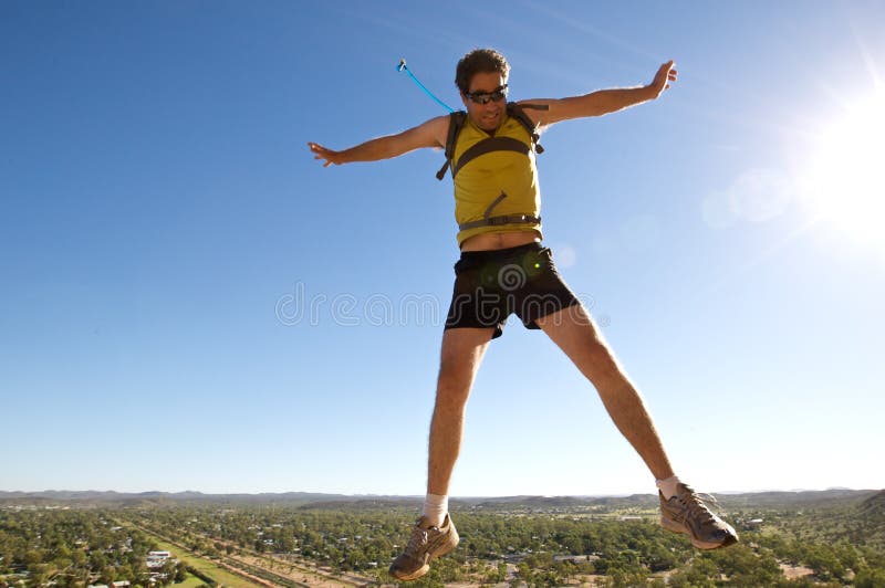 Male Jumping Infront Of Vista Stock Image - Image of mountain, look ...