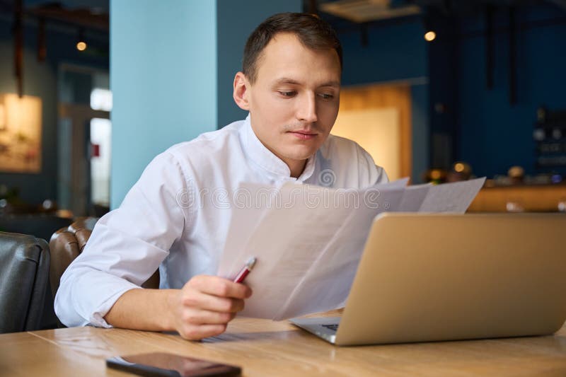 Male in a Kitchen Uniform Works with Work Documents Stock Photo - Image ...