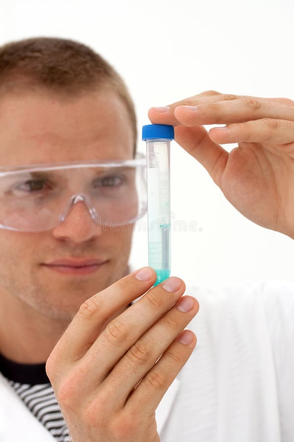 Male Lab Technician Looking at Test Tube Stock Photo - Image of ...