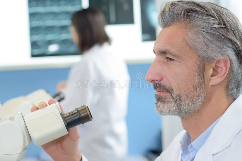 Male lab worker in profile stock image. Image of profile - 309331115