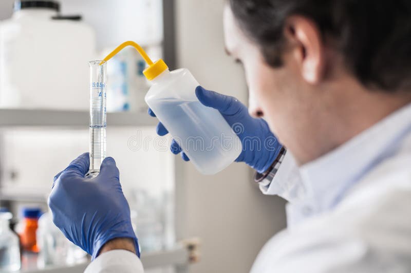 Male Laboratory Researcher Performs Tests Stock Image - Image of ...