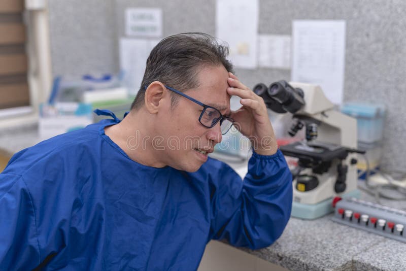 A Male Laboratory Technician or Microbiologist in His 40s Having ...