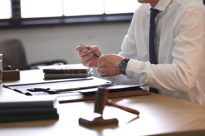Male Lawyer Working at Table in Office Stock Photo - Image of ...