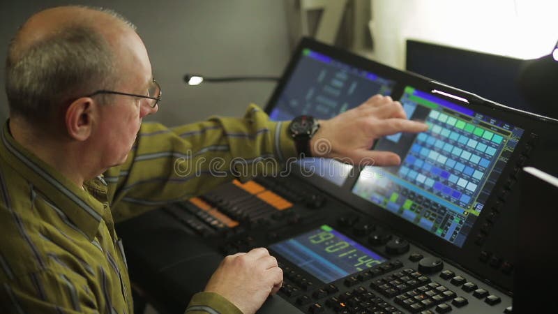 A Male Stage Worker Connects a Cable To Lighting Devices. Stock Video ...