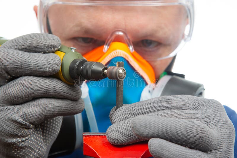 Male Locksmith Worker Processes Metal with Engraving Drill Cutting. the ...