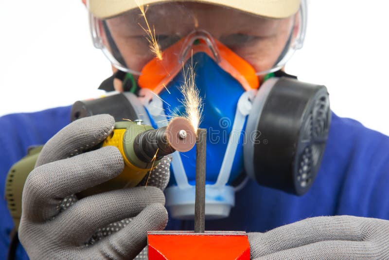 Male Locksmith Worker Processes Metal with Engraving Drill Cutting. the ...