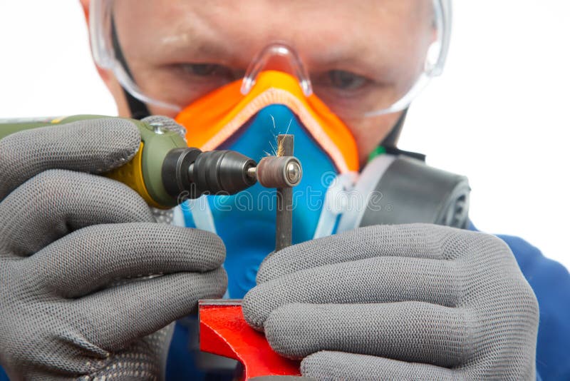 Male Locksmith Worker Processes Metal with Engraving Drill Cutting. the ...