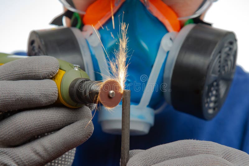 Male Locksmith Worker Processes Metal with Engraving Drill Cutting. the ...