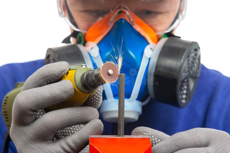 Male Locksmith Worker Processes Metal with Engraving Drill Cutting. the ...