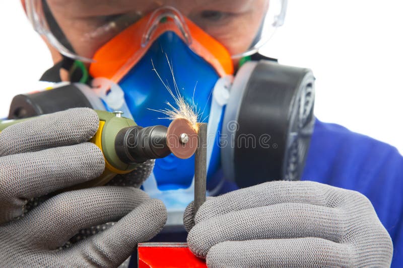 Male Locksmith Worker Processes Metal with Engraving Drill Cutting. the ...