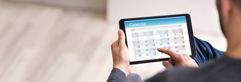 Male Looking at Calendar stock image. Image of gift - 211513443