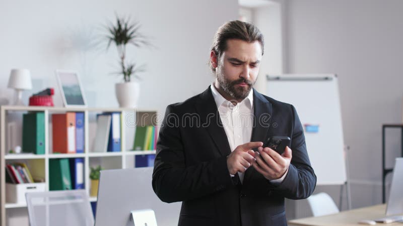 Male Manager Browsing Phone during Work at Office Room Stock Video ...