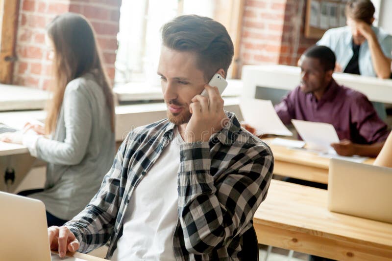 Male Manager Consulting Client Over Cellphone Stock Photo - Image of ...