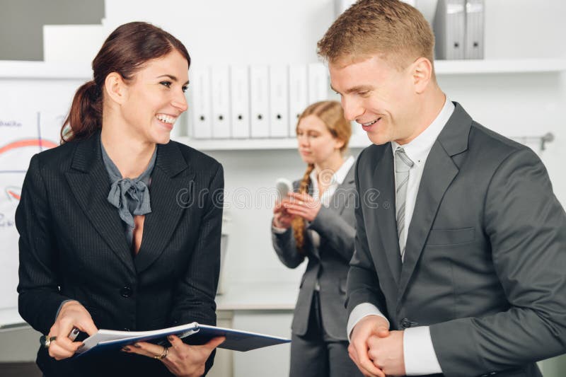 Male Manager Instructs Female Employee in Office Stock Photo - Image of ...