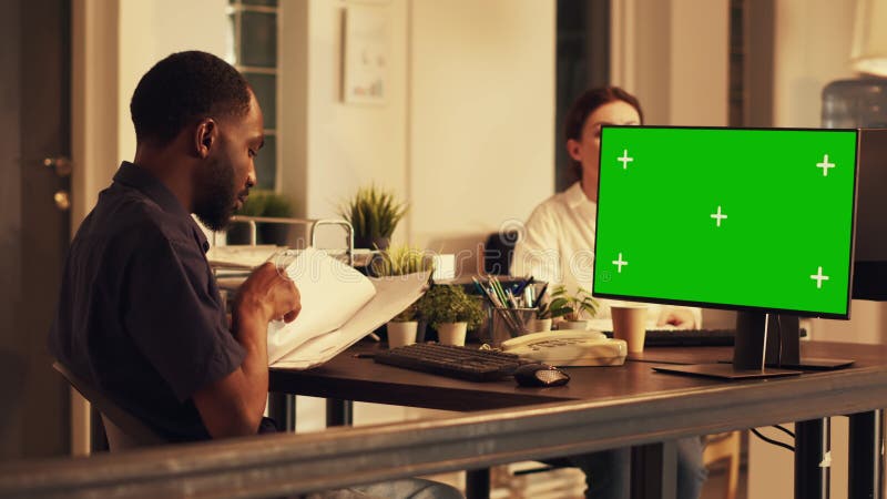 Male Manager Looking at Computer with Greenscreen Display Stock Footage ...