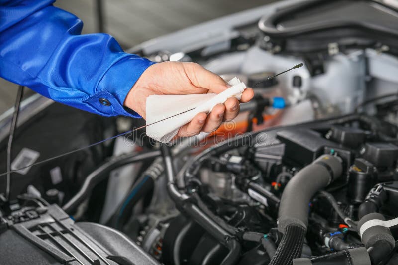 Male Mechanic Checking Level of Oil in Car Engine Stock Image - Image ...