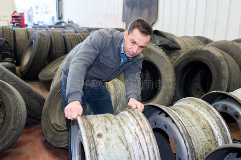Male Mechanic Checking Texture Old Tyre Stock Image - Image of ...