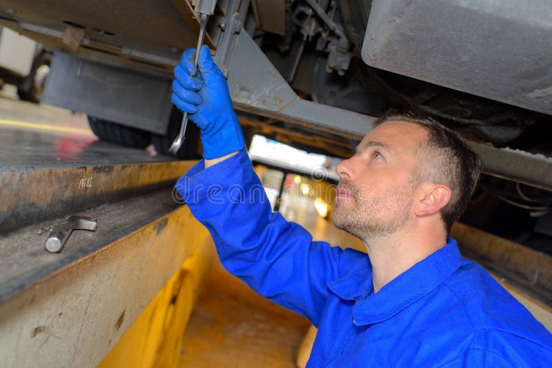 Male Mechanic Fixing Vehicle Stock Photo - Image of diagnostic, service ...