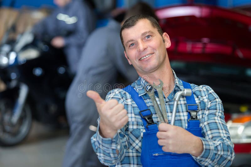Male Mechanic Making Thumbs Up Gesture Stock Photo - Image of positive ...