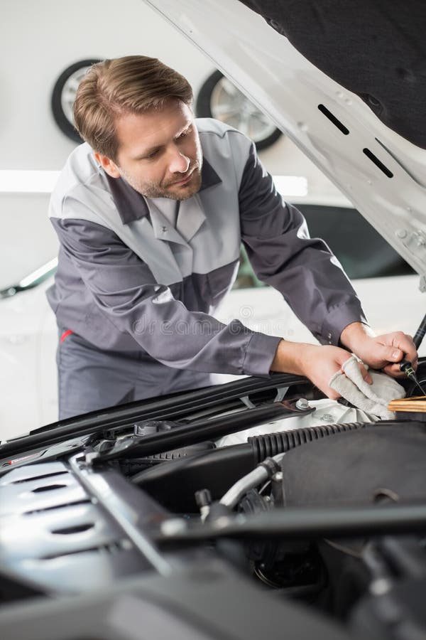 Male Mechanic Repairing Car Engine in Workshop Stock Photo - Image of ...
