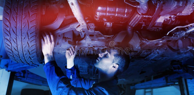 Mechanic Under Car in Garage Stock Photo - Image of view, repair: 100814576